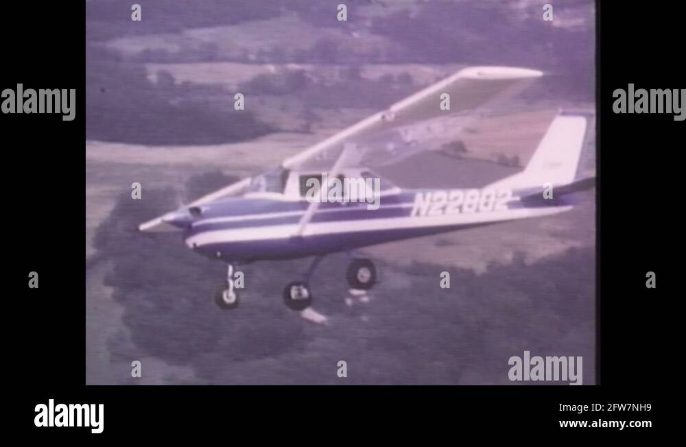 1970s: UNITED STATES: Small plane flies in sky. Model of plane. Plane ...