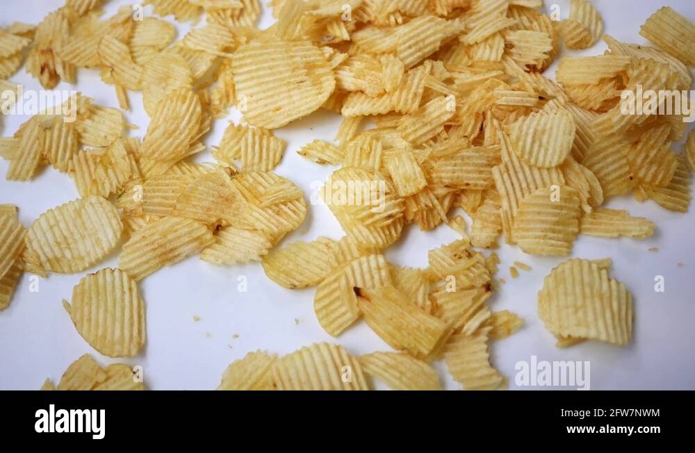 Plain Potato Chips rotating over white background - Overhead Angle ...