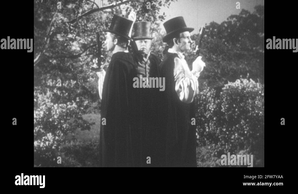 1950s: Two men with their backs turned to each other prepare a duel ...