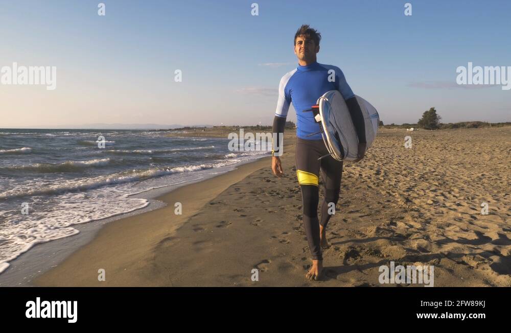 Man carrying surf board at beach Stock Videos & Footage - HD and 4K ...
