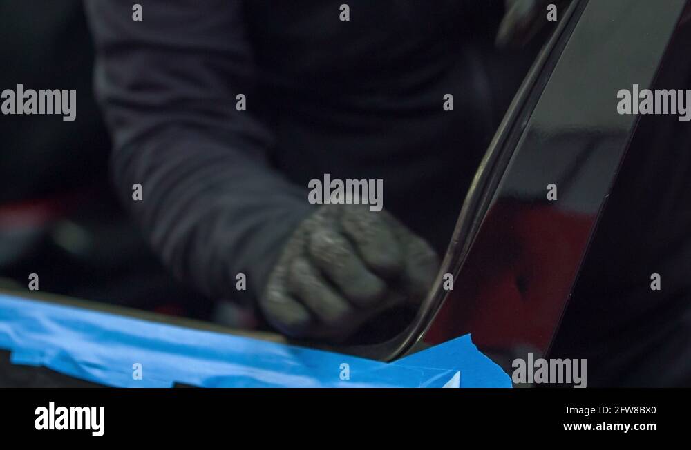 Fixing a car window in a automobile repair shop Stock Video Footage - Alamy