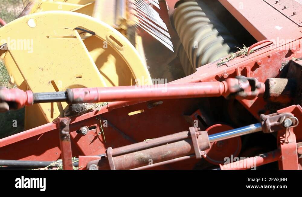 Farm swather turning P HD 0852 Stock Video Footage - Alamy
