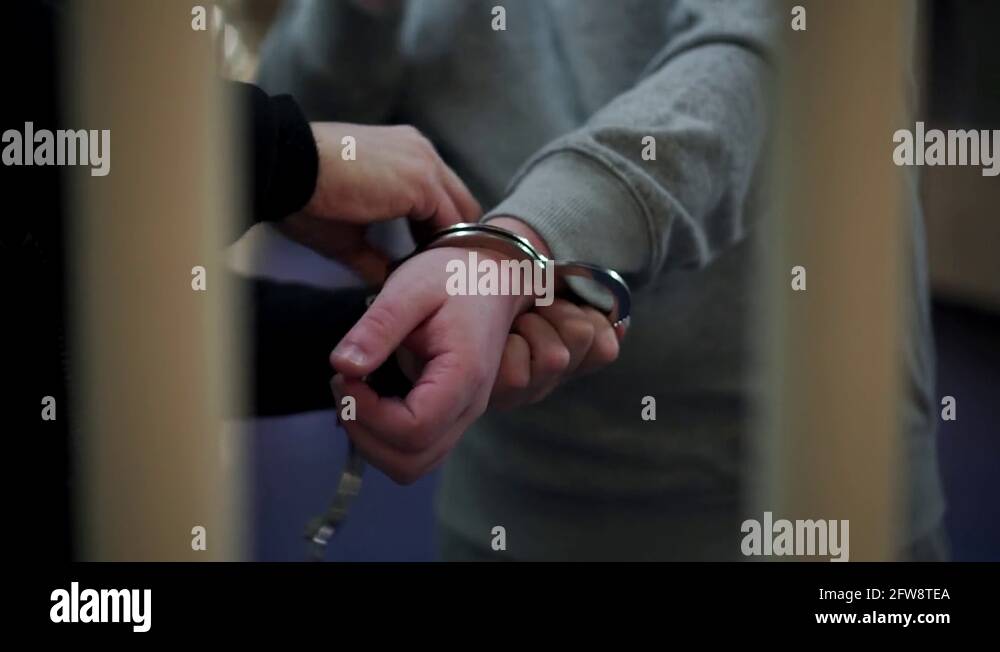 Prison Guard Removes Handcuffs From Inmate, 4K Prisoner Incarceration ...