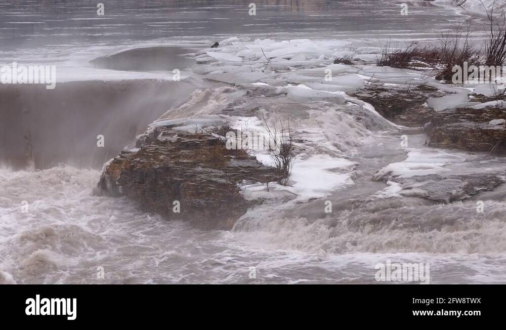 Flooding and fast moving water on the grand river at Cambridge Canada ...