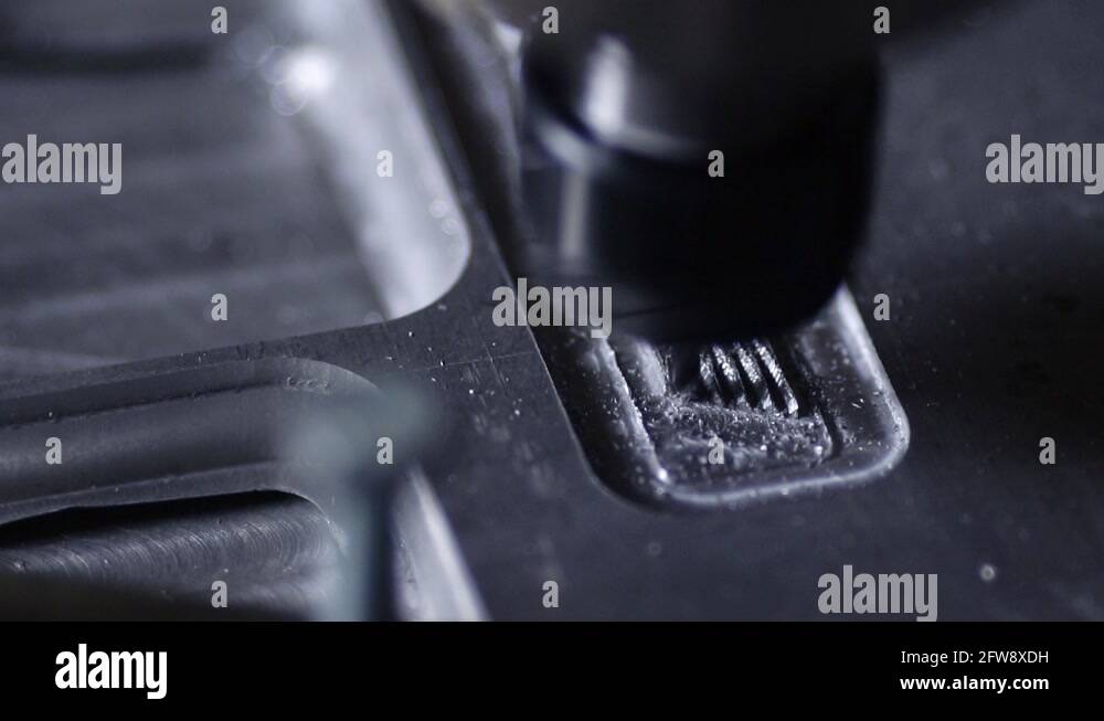 Milling machine for cutting steel handles a piece of aluminum. The ...