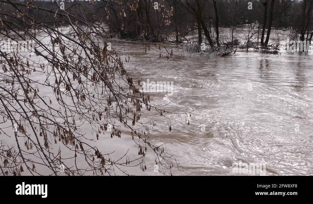 River flooding it's banks during spring thaw and snow melting season ...