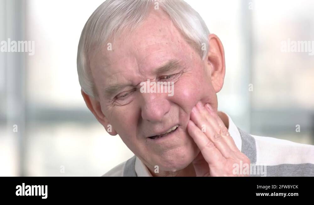 Sad old man touching his cheek Stock Video Footage - Alamy