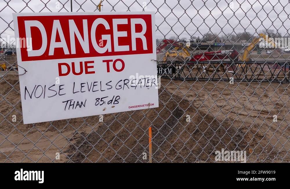 Loud noise warning signs at construction site Stock Video Footage - Alamy
