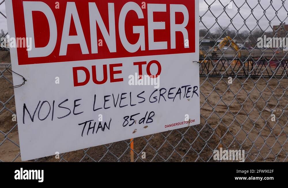 Loud noise warning signs at construction site Stock Video Footage - Alamy
