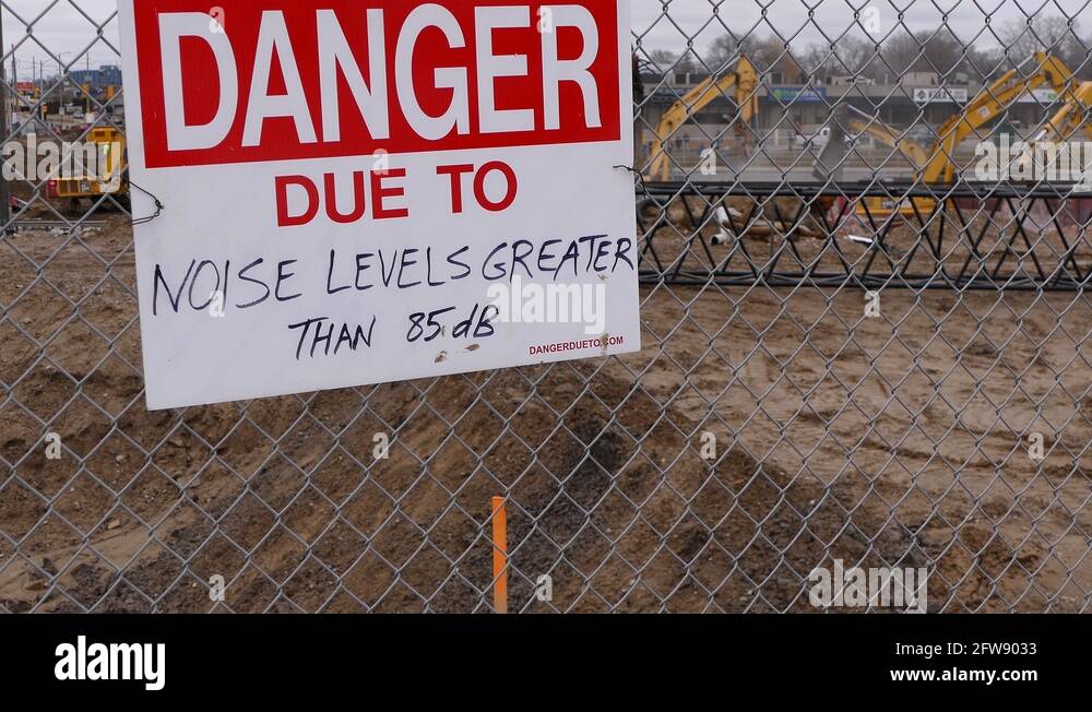 Loud noise warning signs at construction site Stock Video Footage - Alamy