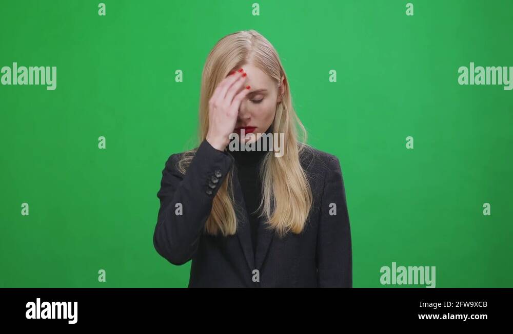 Beautiful girl shows emotions, actor play, sad, green background Stock ...