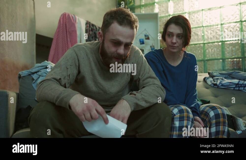 Sad young poor couple holding a document talk feel stress unhealthy ...