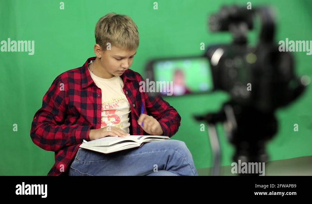 The boy video blogger writes a script for the plot Stock Video Footage ...