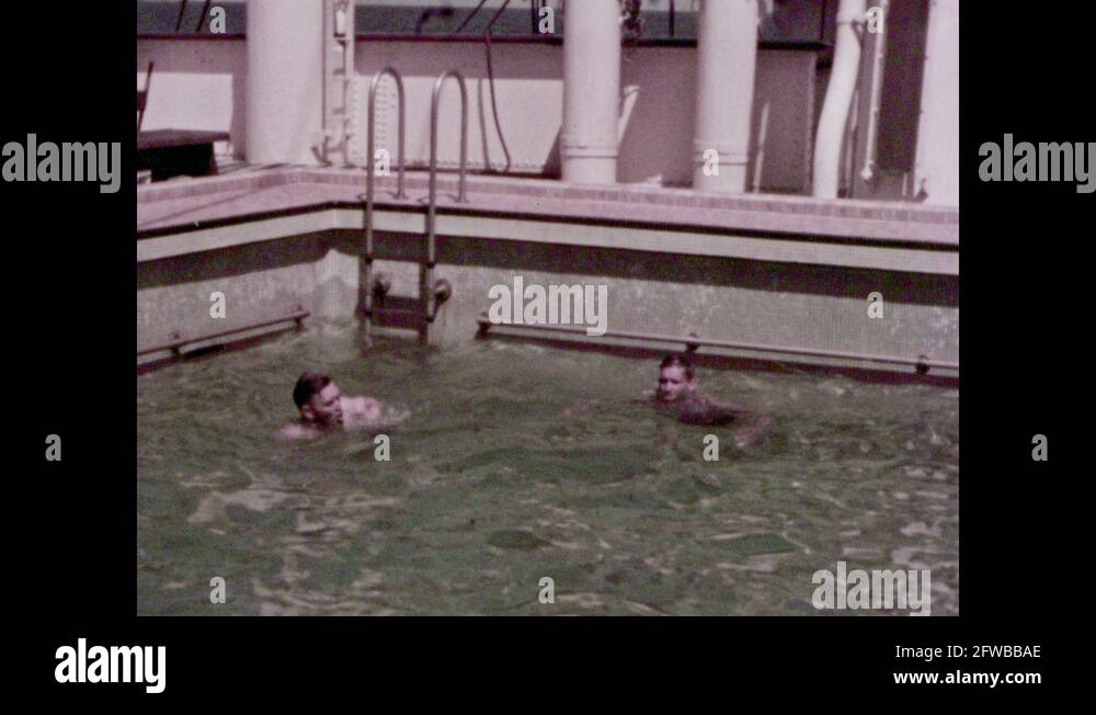 1940s: Men and woman splash and swim in pool Stock Video Footage - Alamy