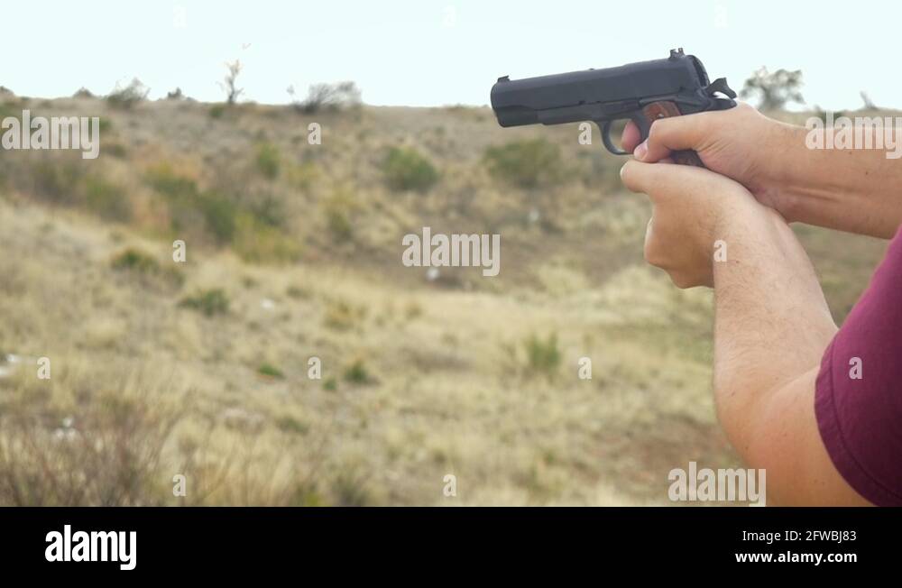 Man firing a handgun Stock Videos & Footage - HD and 4K Video Clips - Alamy