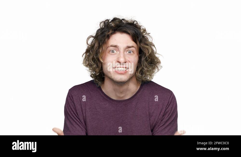 Portrait of angry tense man 20s grabbing his head and screaming, while ...