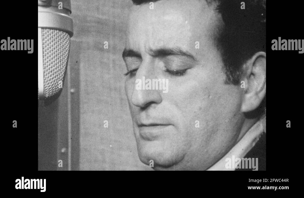 1960s: Vocalist sings into microphone and reads music. Tony Bennett ...