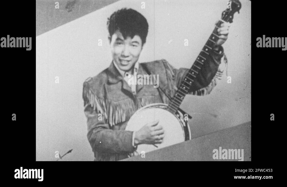 1960s: Still image of man holding banjo. Still image of five men ...