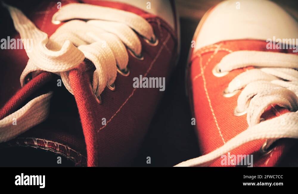 Red plimsolls Stock Videos & Footage - HD and 4K Video Clips - Alamy