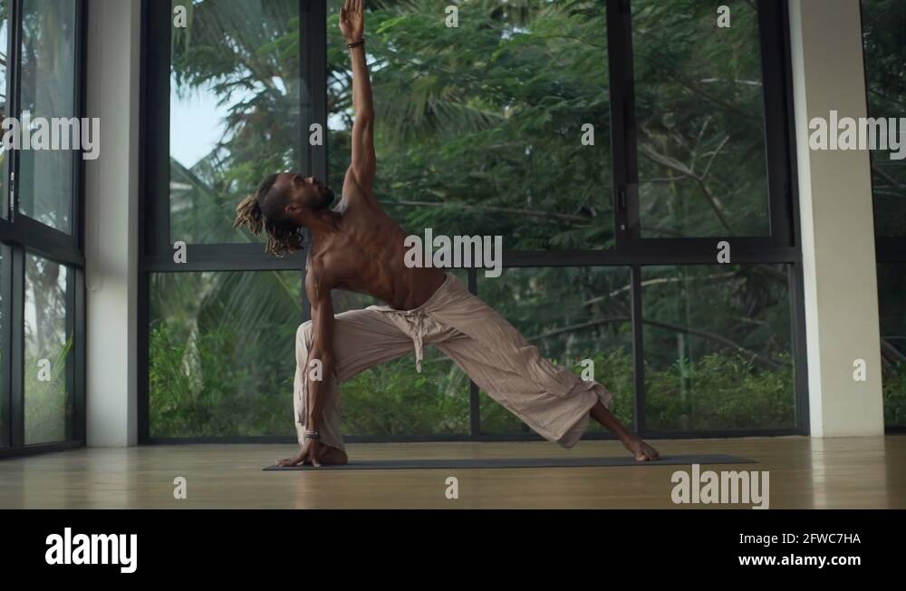 Bikram triangle pose Stock Videos & Footage - HD and 4K Video Clips - Alamy