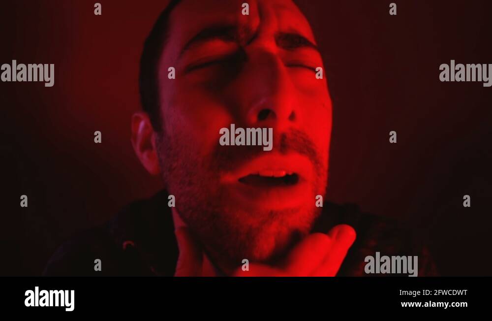 Man is choking and grabbing his neck with his hands Stock Video Footage ...