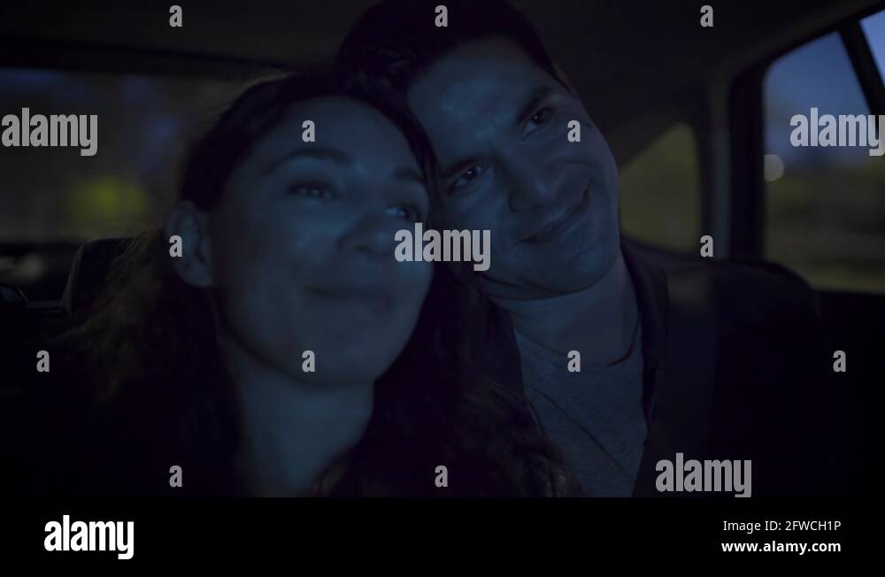 Cute Couple Cuddle In Back Seat Of Car, They Drive Through Downtown Los ...