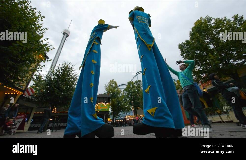 Amusement Park Excitement. A Fairground With Carnival Rides And Happy ...