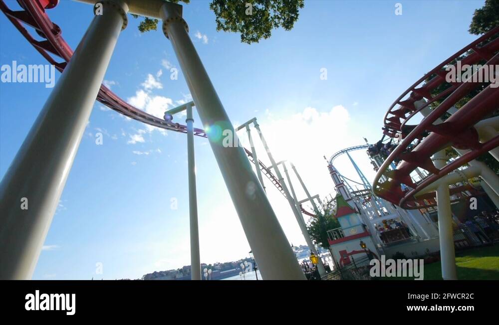 Amusement Park Excitement. A Fairground With Carnival Rides And Happy ...