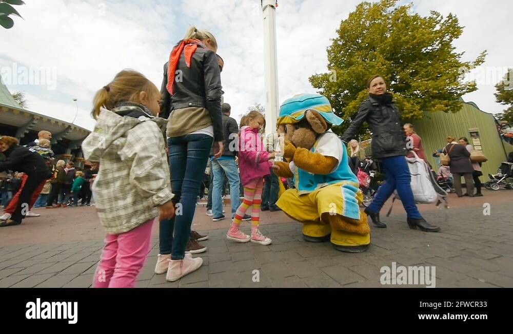 Amusement Park Excitement. A Fairground With Carnival Rides And Happy ...