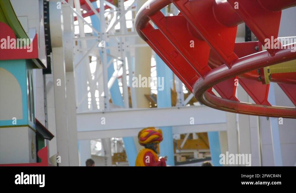 Amusement Park Excitement. A Fairground With Carnival Rides And Happy ...