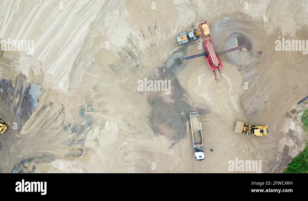 Excavator loader in sand quarry. View from above. Aerial view dumper ...