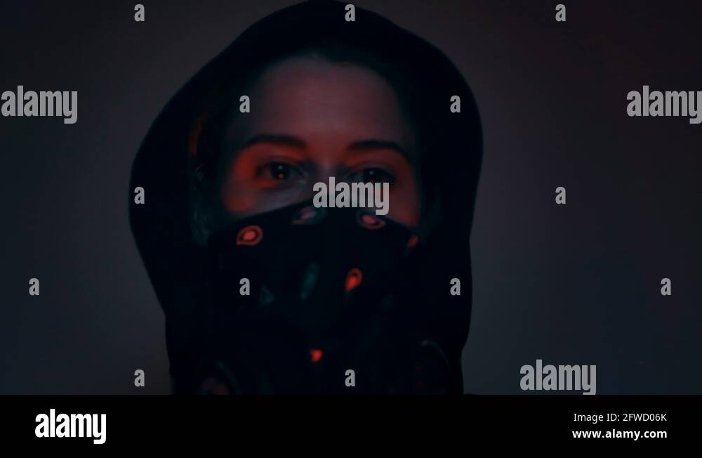 Low angle shot of hacker hacking. Dim lighting, with small red light ...