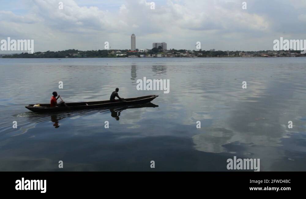 Two men on pirogue, ébrié lagoon, Abidjan, Ivory Coast Stock Video ...