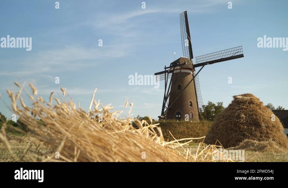 Typical Dutch Windmill with a traditional hay bale - Slider / Medium ...