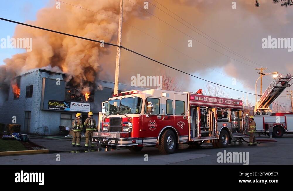 Ladder from firetruck turning steadily and positioning to fight major ...