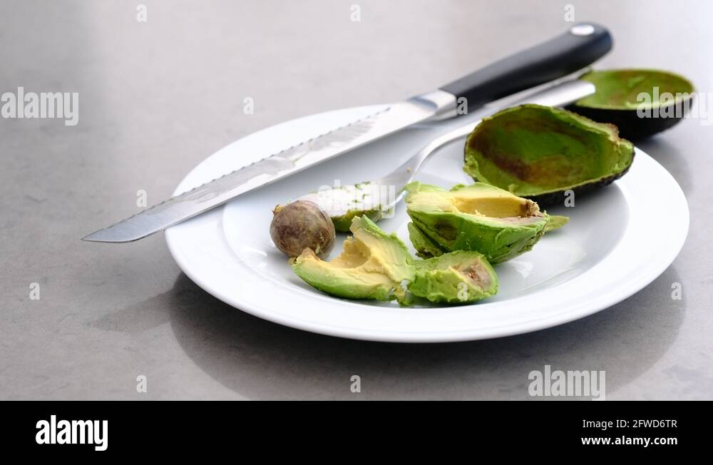 Cutting up a very ripe Avocado with a knife Stock Video Footage - Alamy