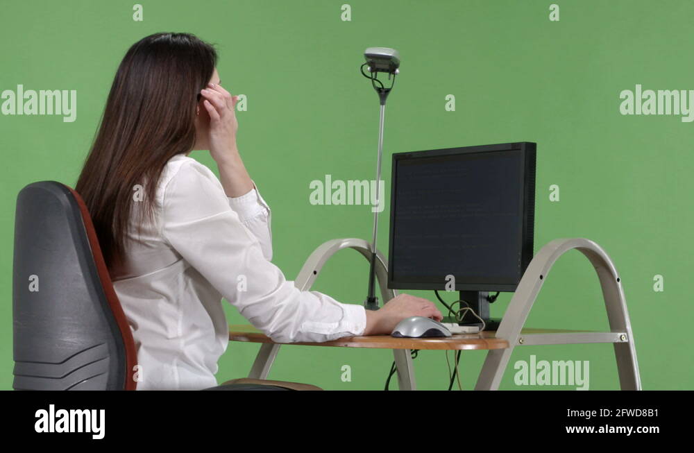 office worker trying to use desktop computer with critical error ...