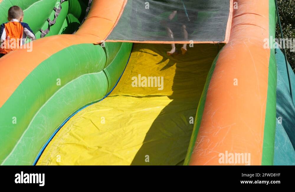 Children sliding down water slide Stock Videos & Footage - HD and 4K ...