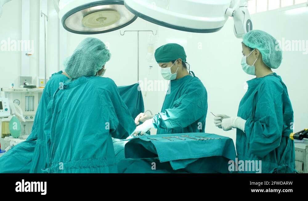 The surgery team working together at the operating room in the hospital ...