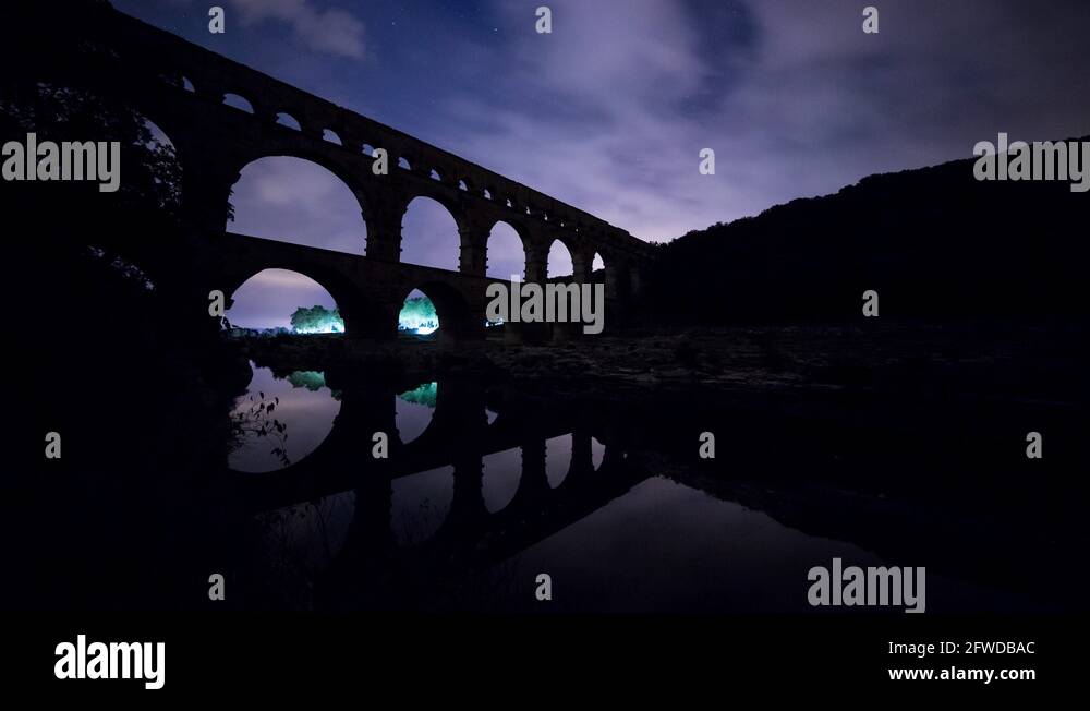 Night time lapse of an old roman bridge, pont du gard aqueduct Stock ...