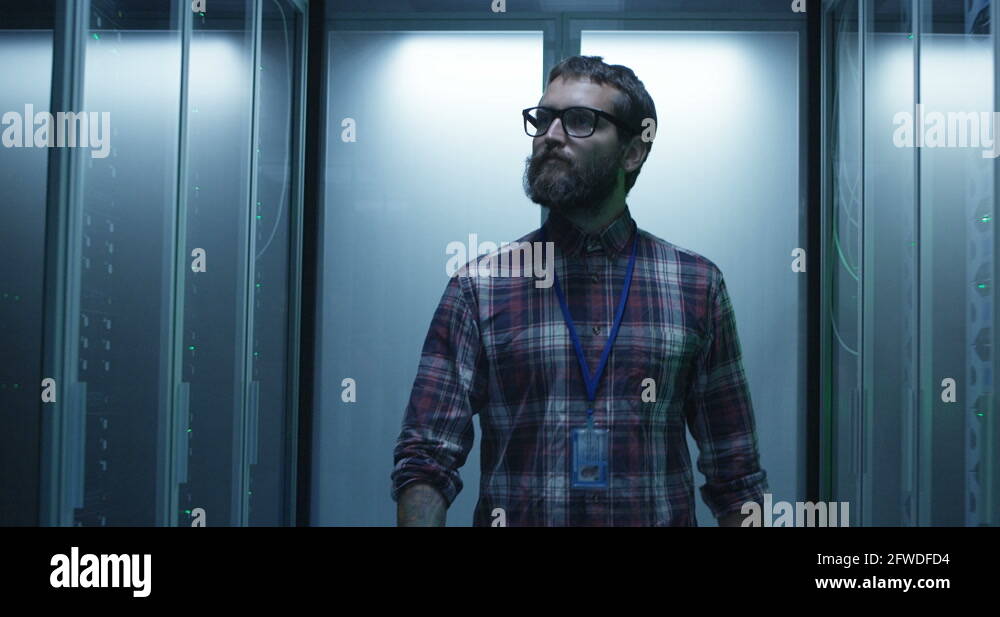 Bearded IT specialist setting servers in data center Stock Video ...