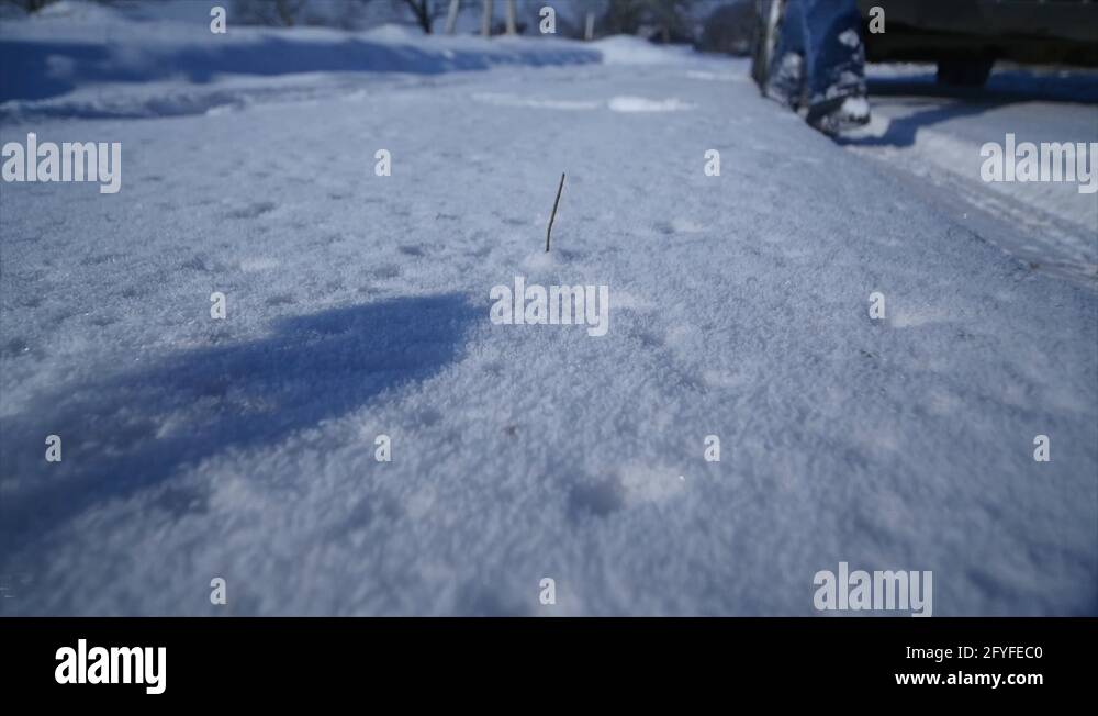 feet walking in deep snow shot in slow motion. foot steps of hiker ...