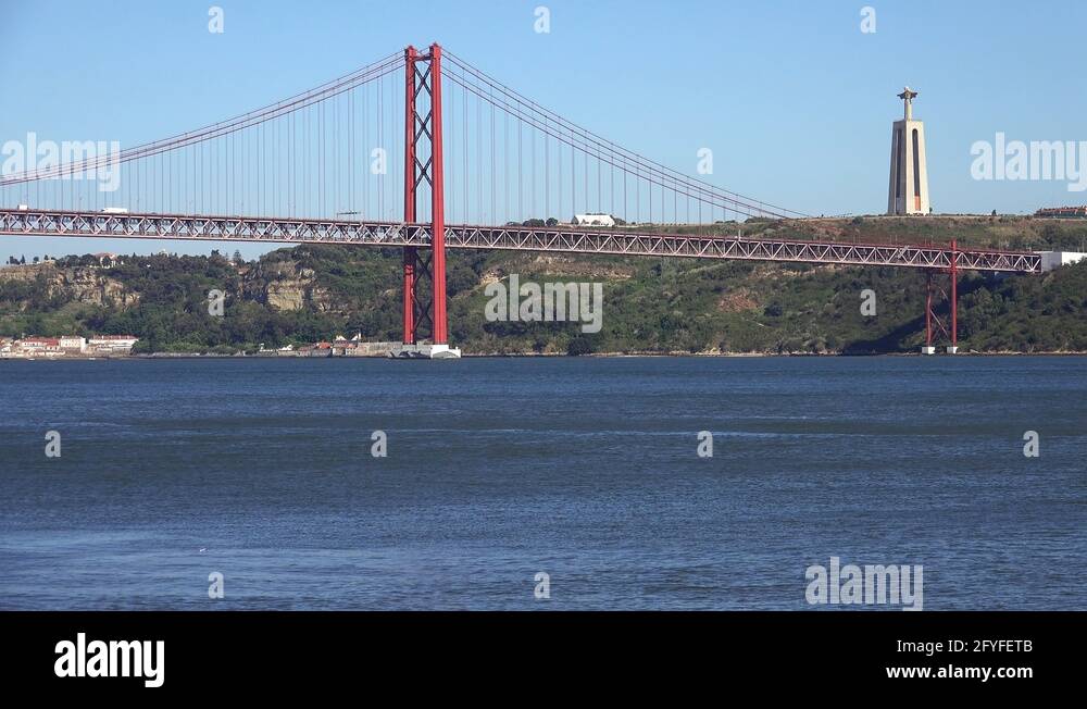 25th of April Bridge suspension bridge over river Tejo with Jesus ...