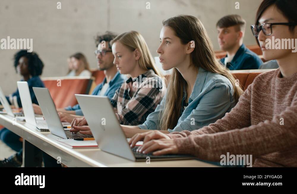 College Students Using Laptops on Lecture in Classroom Stock Video ...