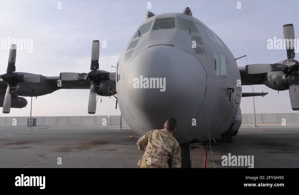 Lt. Col. Josh Koslov commander of USAF inspects an EC-130 Compass Call ...