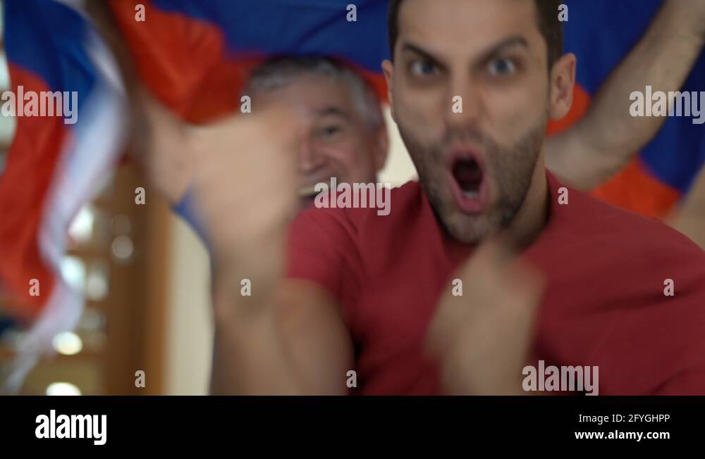 Russian Father and Son Fans Watching and Celebrating a Soccer Game ...