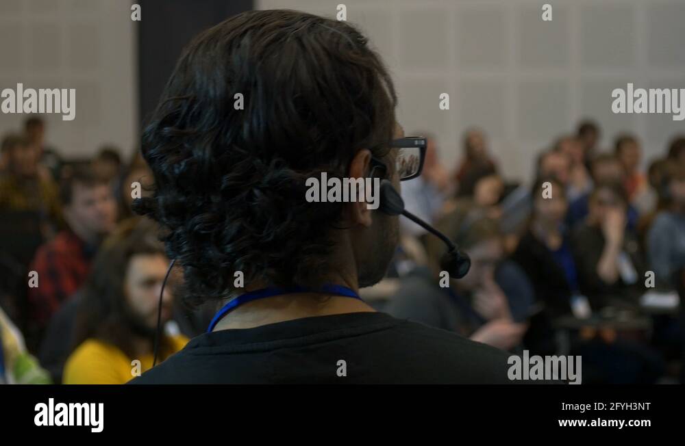 Back view: speech of man with students at university lecture in ...