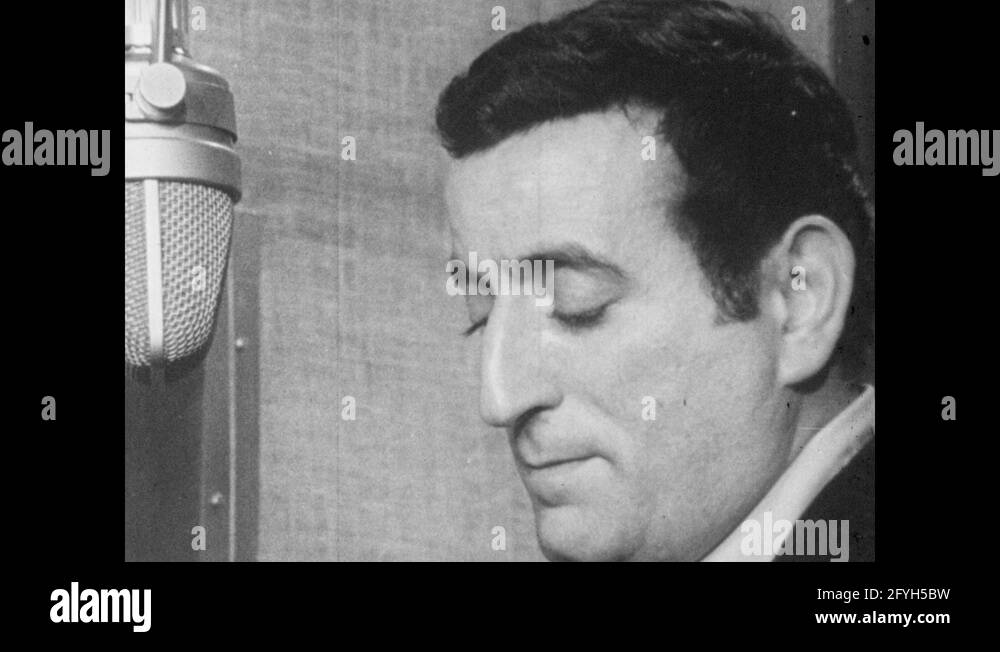 1960s: Vocalist sings into microphone and reads music. Tony Bennett ...