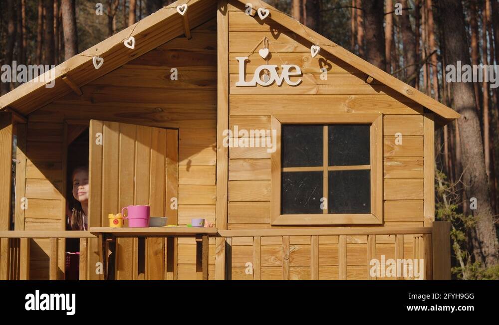 Two girls are playing in a treehouse Stock Video Footage - Alamy