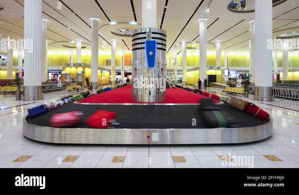 The arrival of luggage on the carousel at Dubai Airport, Dubai, UAE, T ...